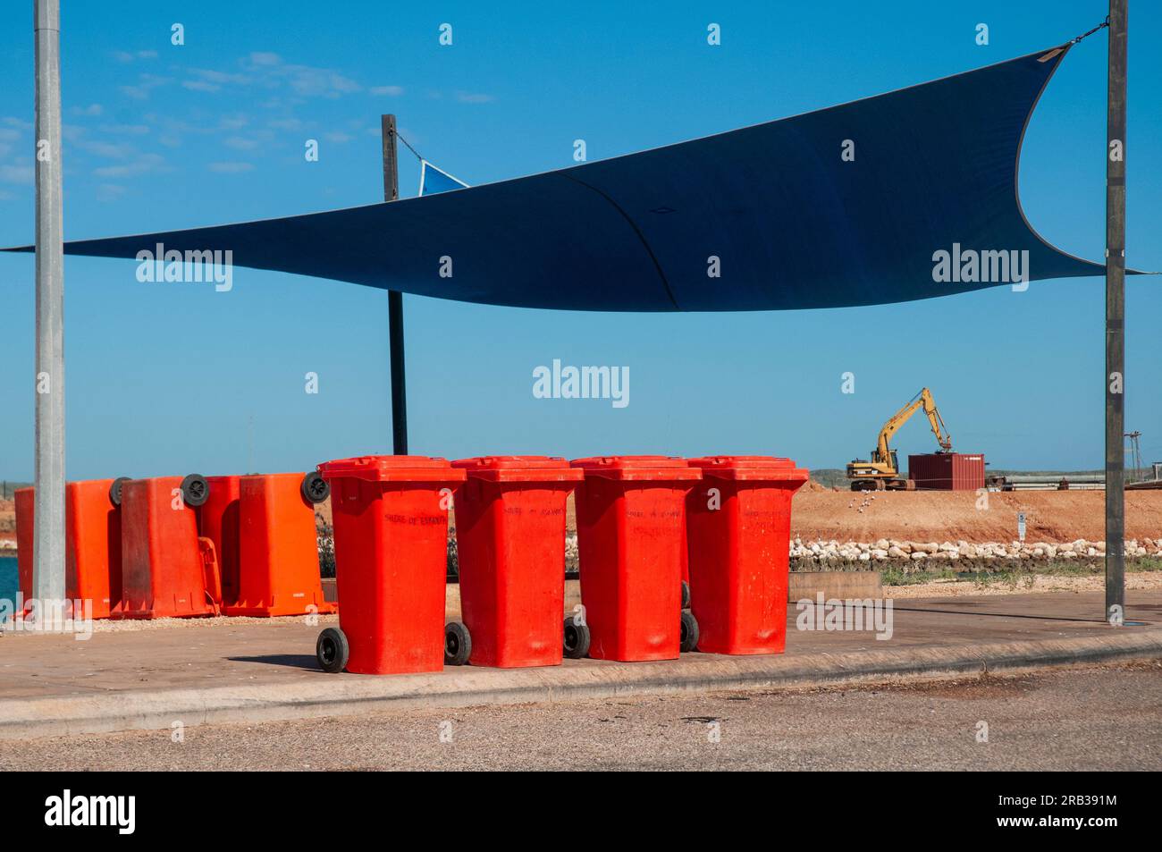 Plastic bins for disposal of fish waste in the coastal town of Exmouth ...