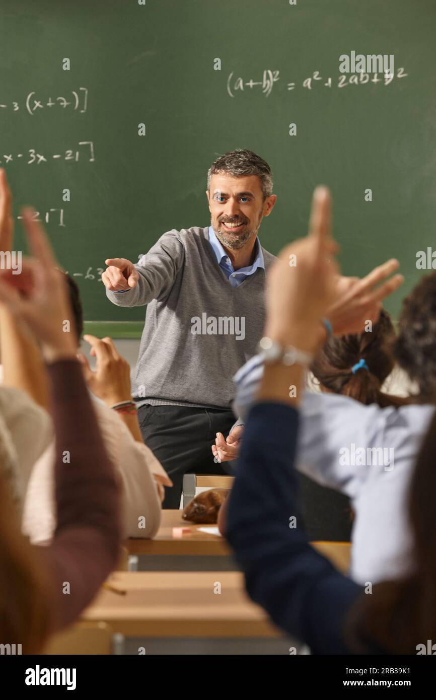 Math teacher giving lessons. Classroom with students. School education ...
