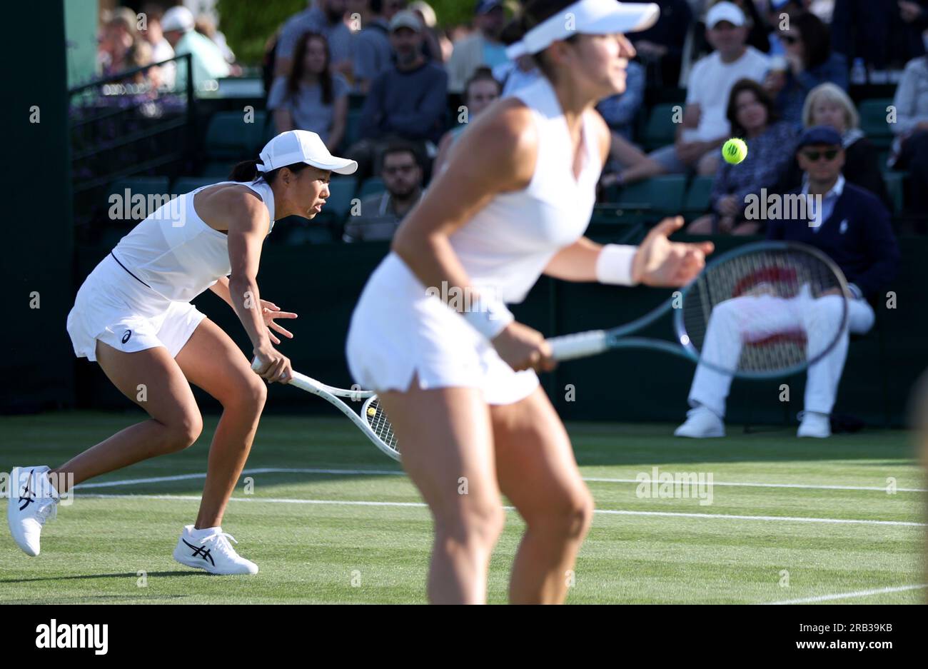 London, Britain. 6th July, 2023. Zhang Shuai (L) of China and Caroline ...