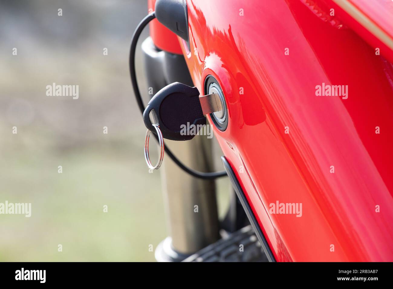 the key is inserted into the keyhole on the frame of the e-bike ...