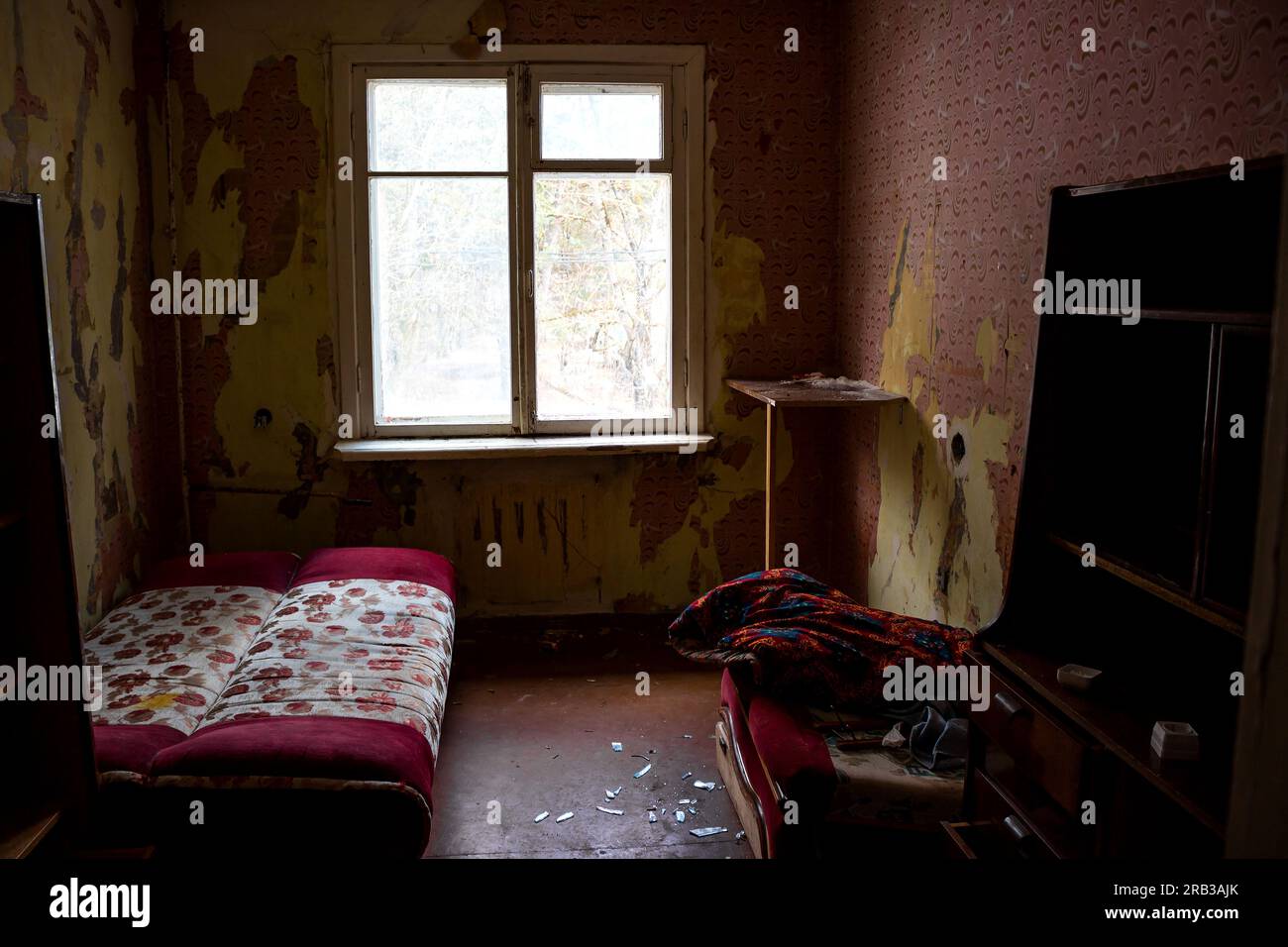 Abandoned living quarters in an old house before demolition, a mess in ...