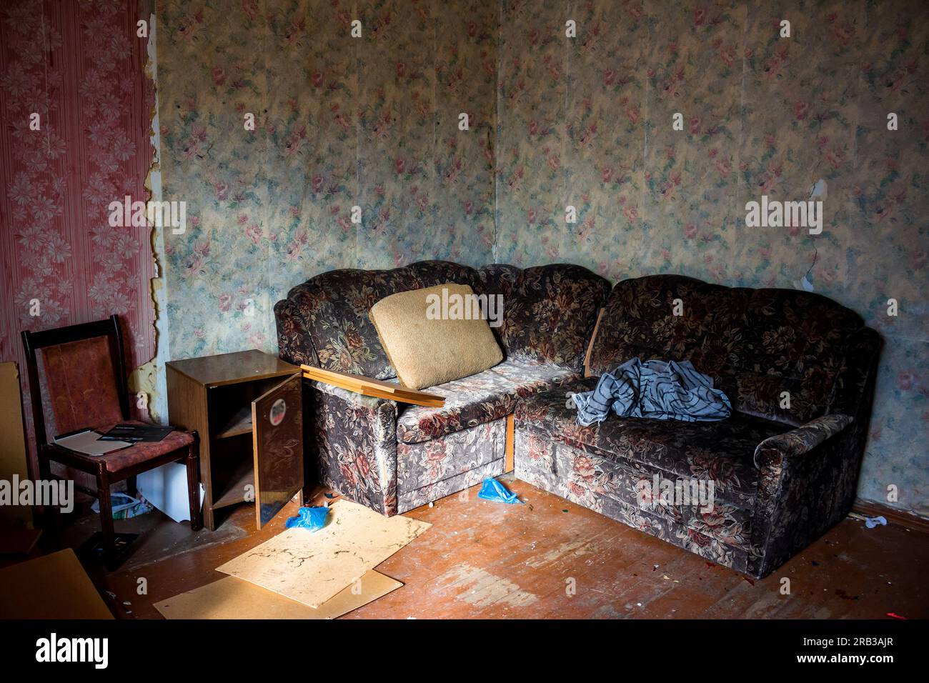 Abandoned living quarters in an old house before demolition, a mess in ...