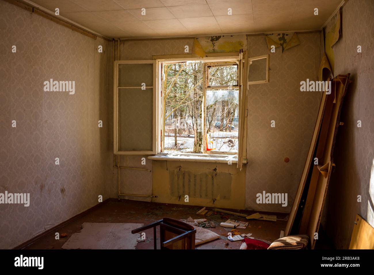 Broken window in a room of an abandoned house, cut off batteries Stock ...