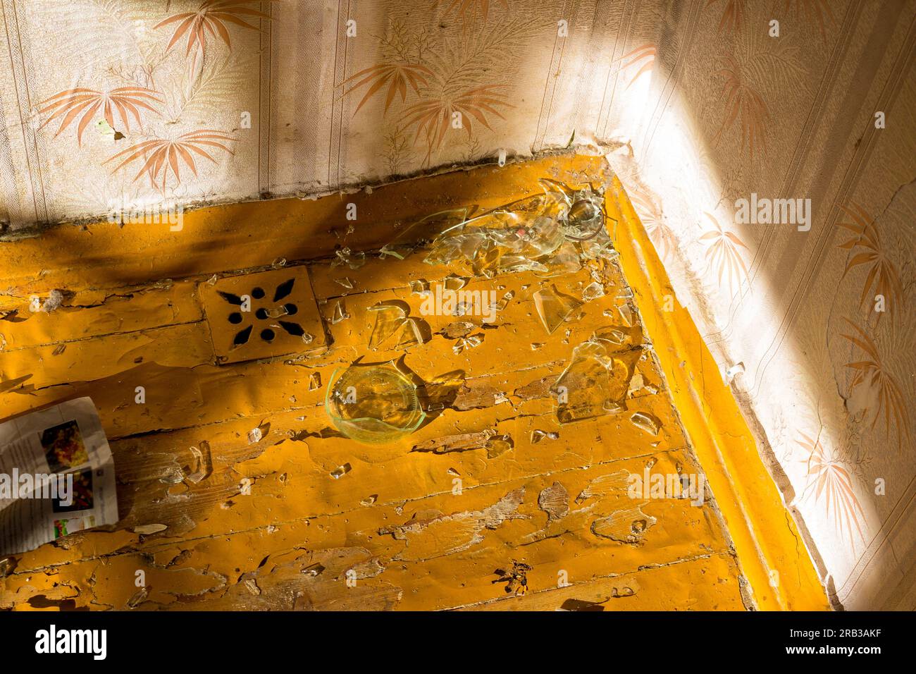Shards from a broken glass jar in the corner of the room Stock Photo ...