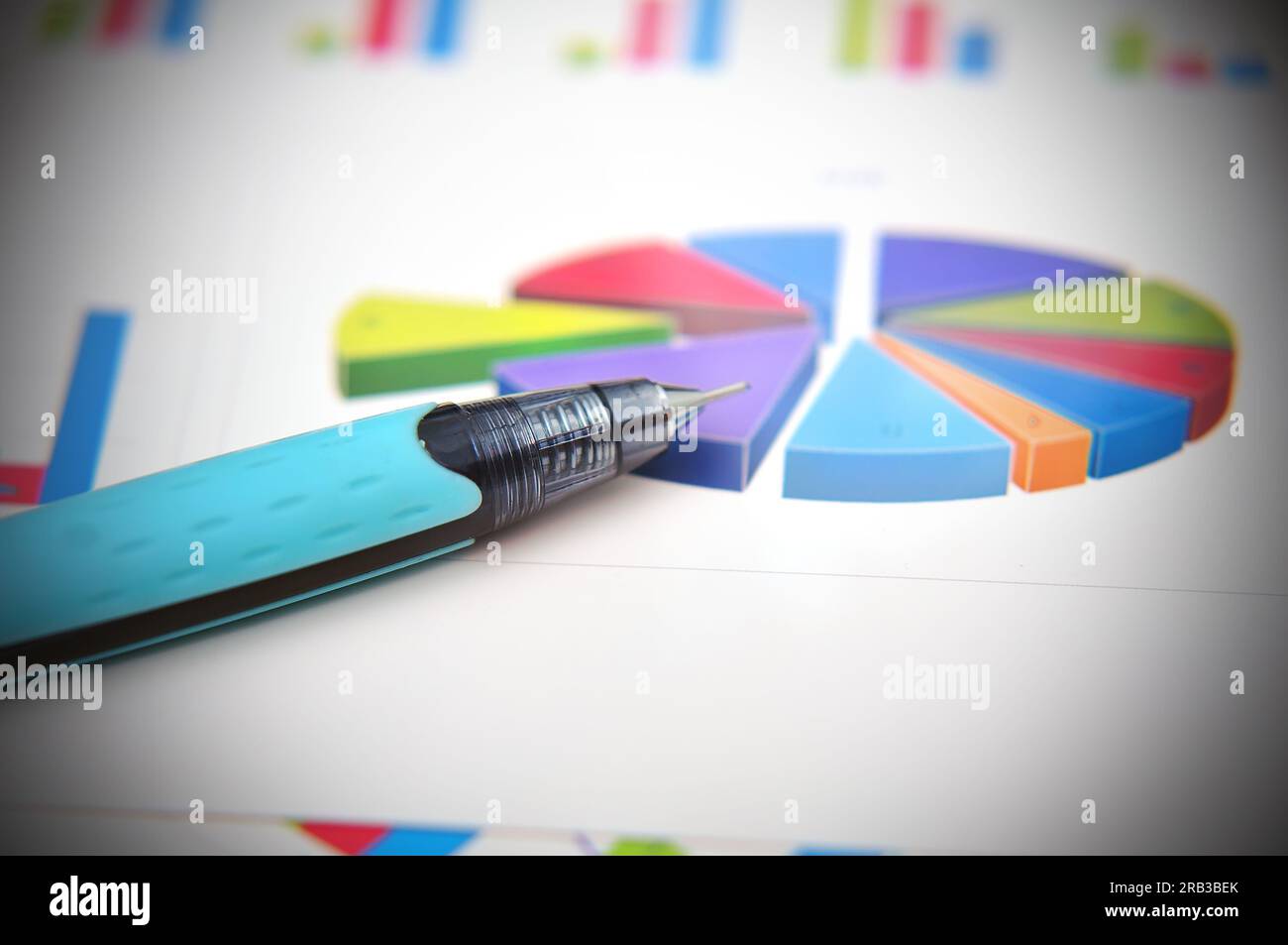 financial color chart on table and pen Stock Photo - Alamy