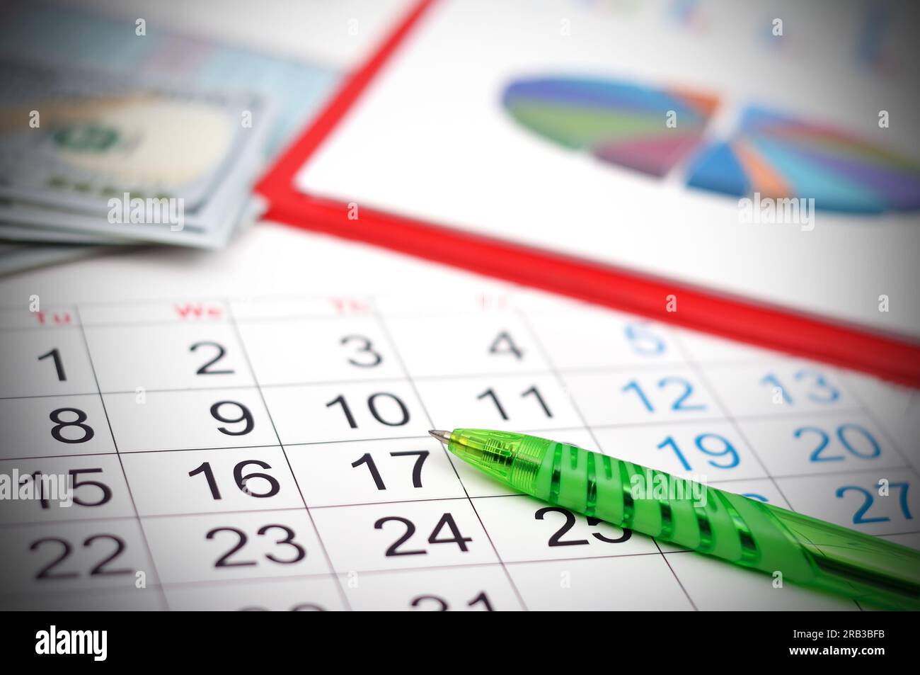 Workplace with calendar and dollars on a wooden work table Stock Photo ...