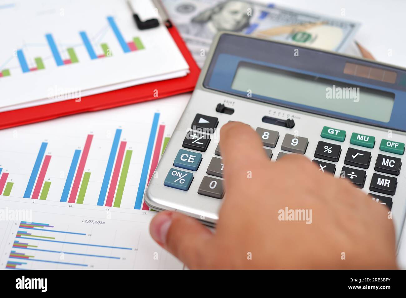 hand pressing a button calculator, close up Stock Photo - Alamy