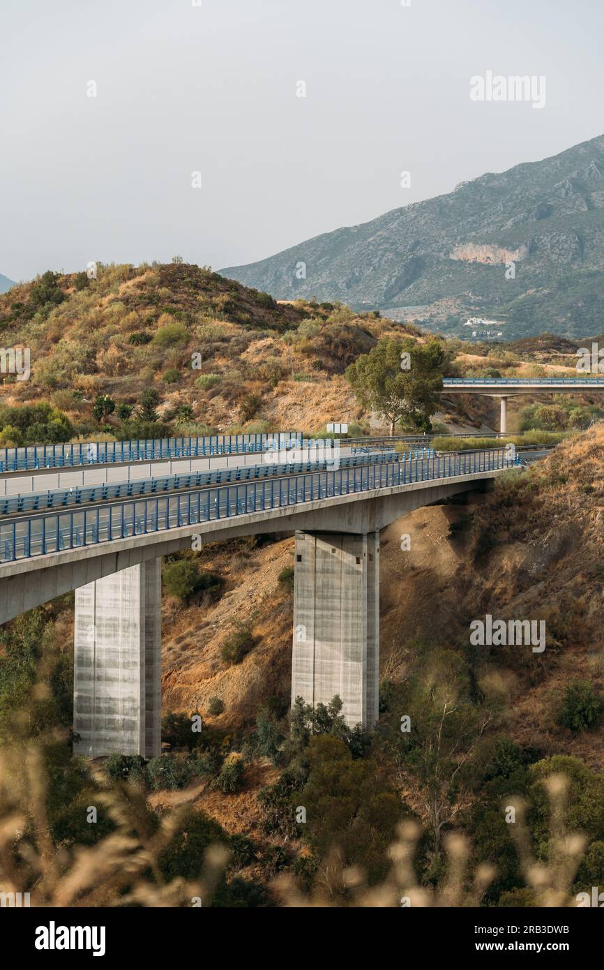Concrete bridge with columns against sky, architectural structure for ...
