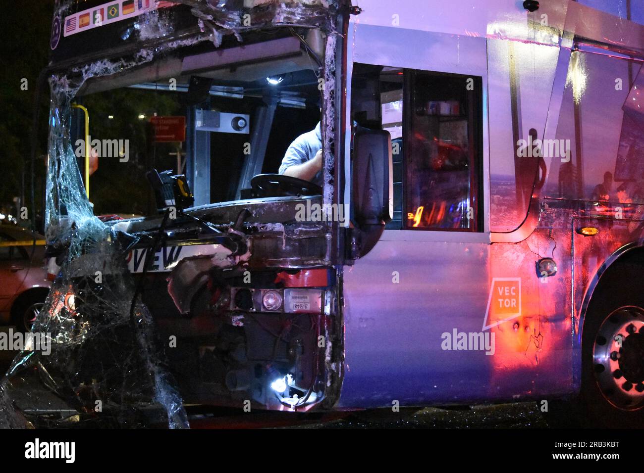 Investigators surround the double decker tour bus involved in the ...