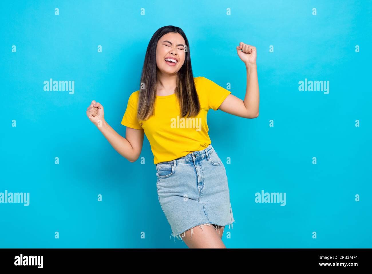 Photo of delighted young korean girl raise fists excited victory eyes ...