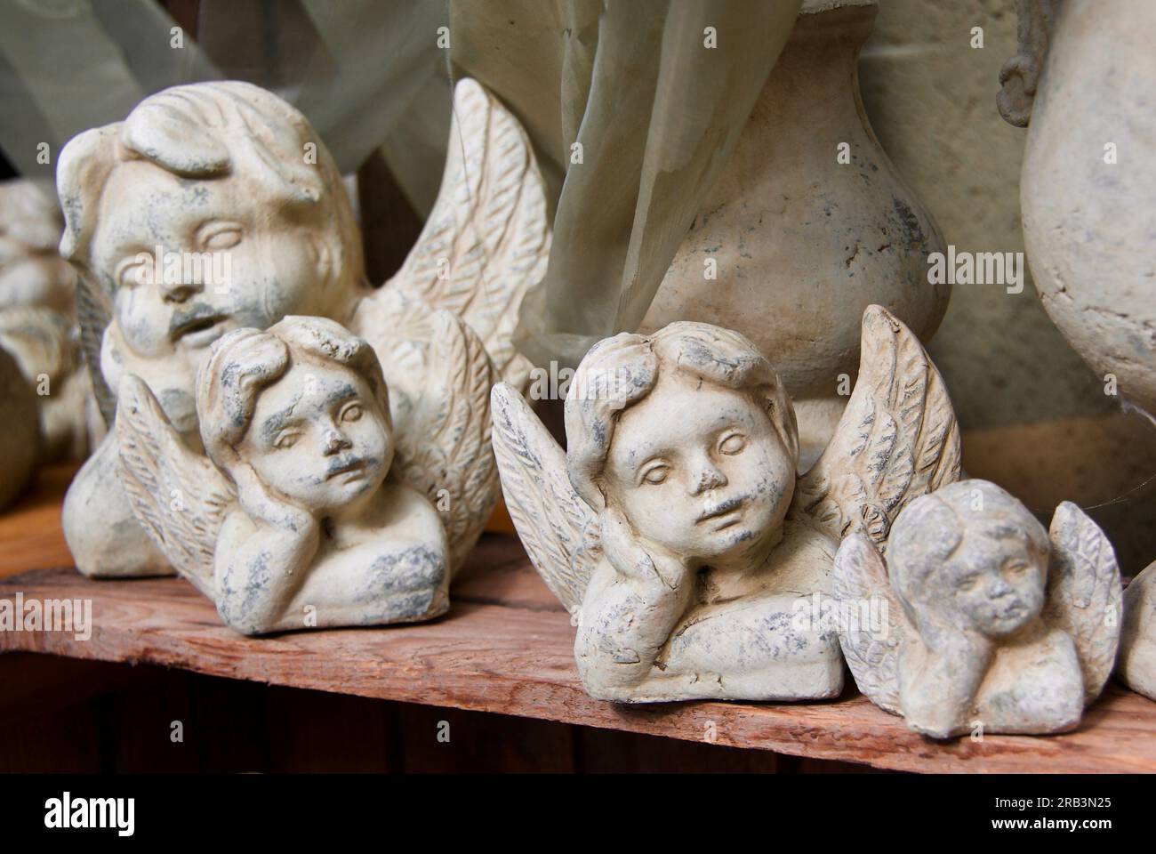 Small decorative angel figurines in old fashioned style Stock Photo - Alamy