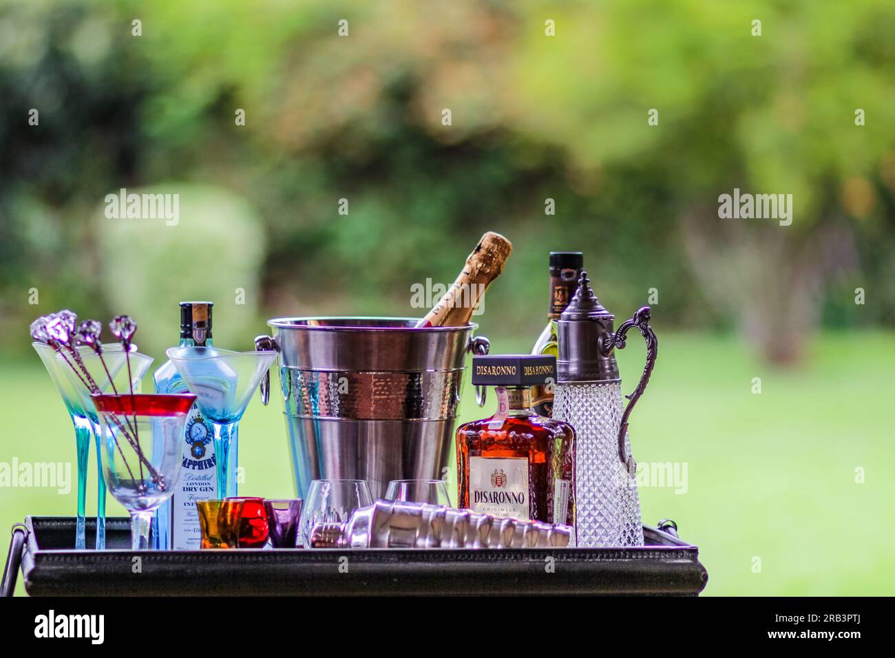 Still life drinks hard and soft display outdoors table Stock Photo - Alamy
