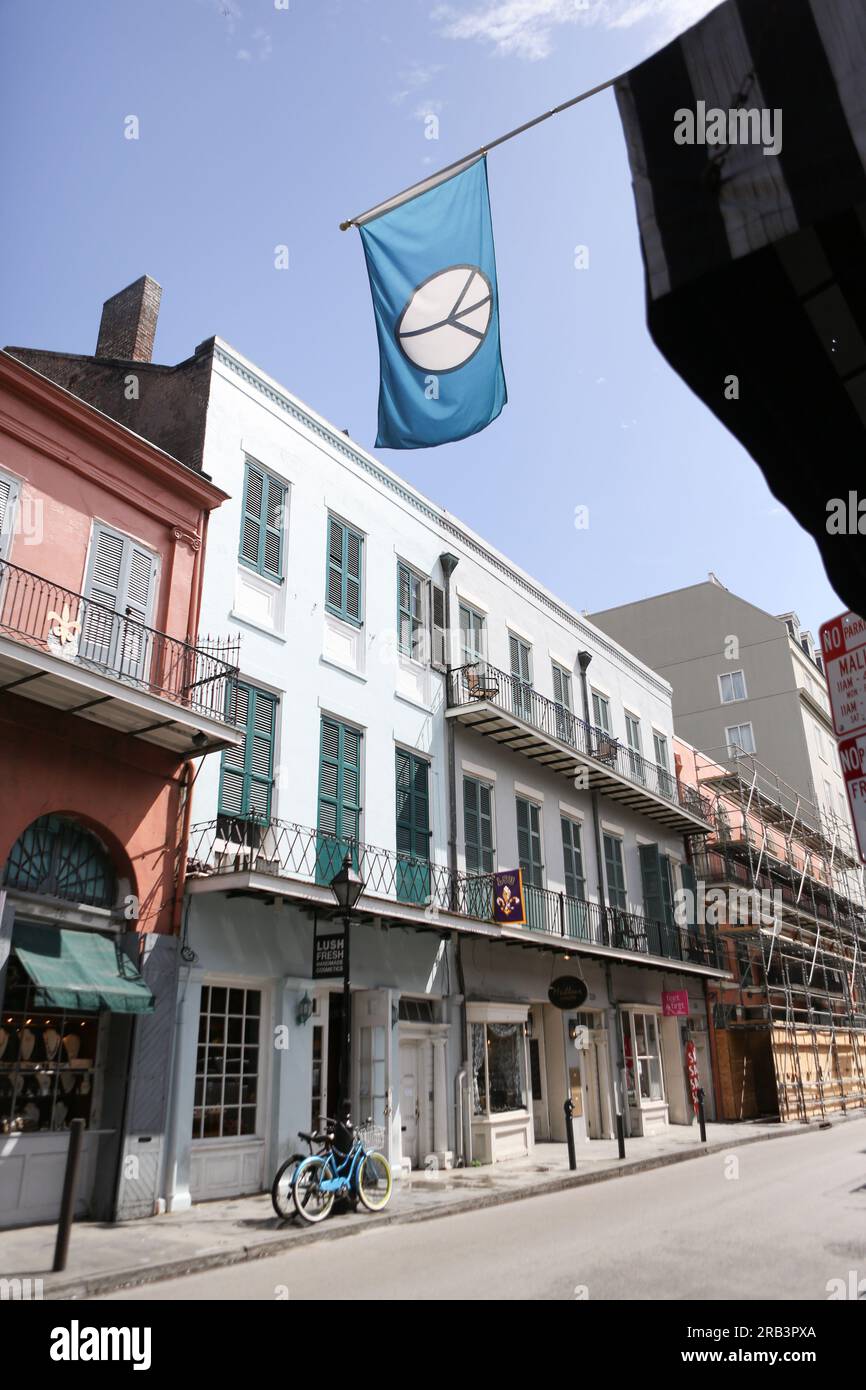 Peace sign flag hanging from balcony in New Orleans Stock Photo - Alamy
