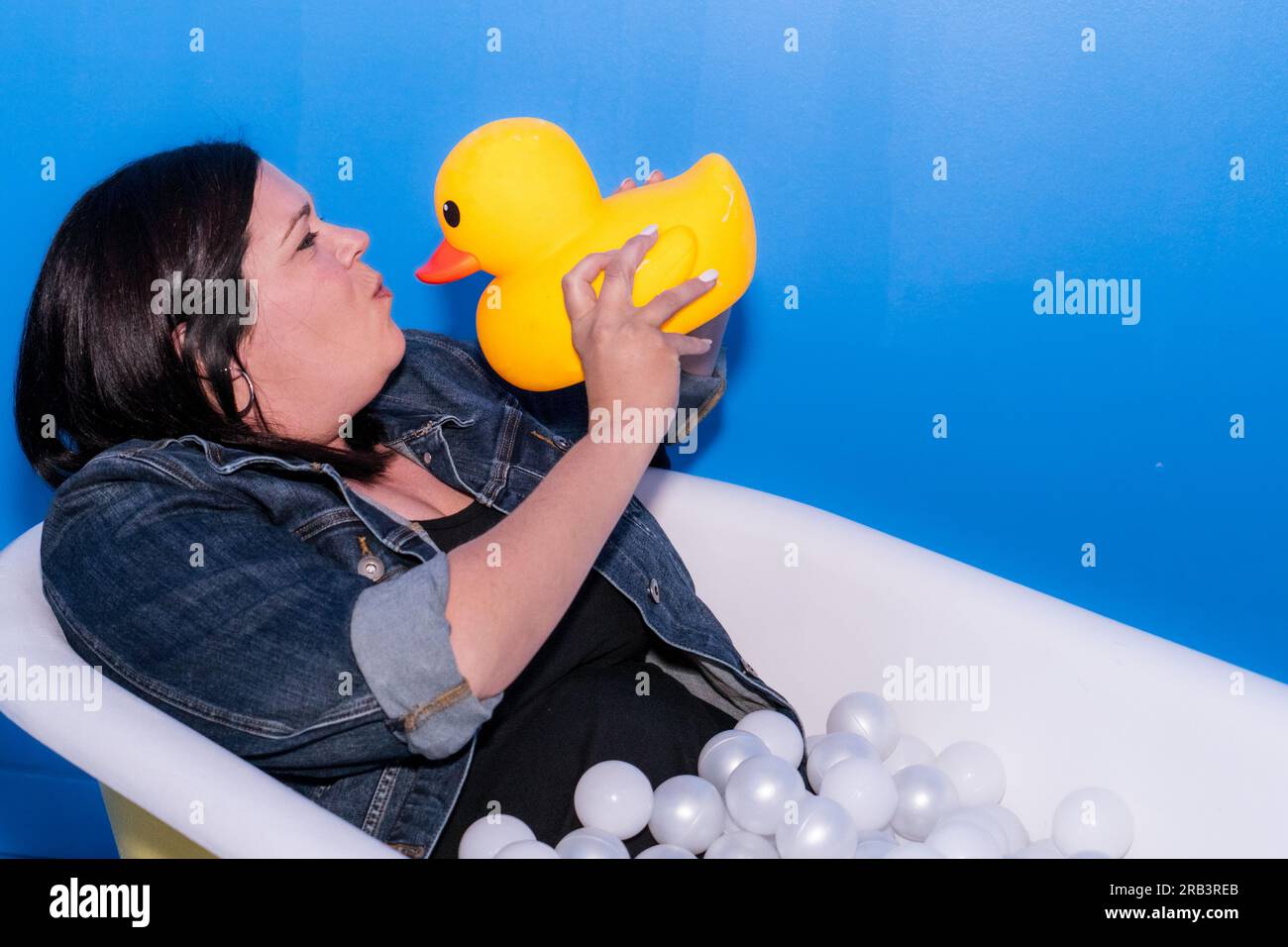 A bubble bath with a yellow ducky Stock Photo - Alamy