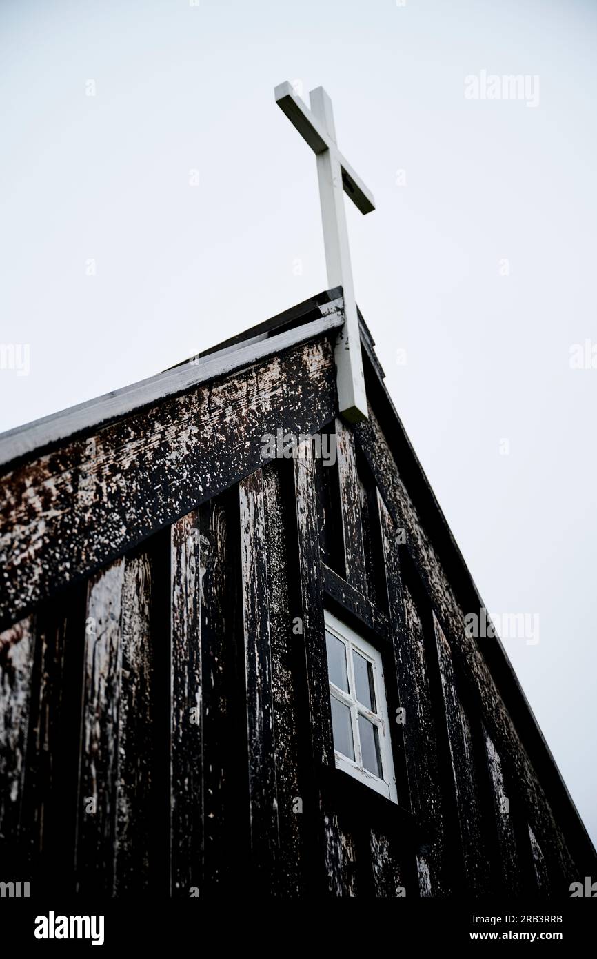 Exterior of shabby chapel with cross on roof Stock Photo - Alamy