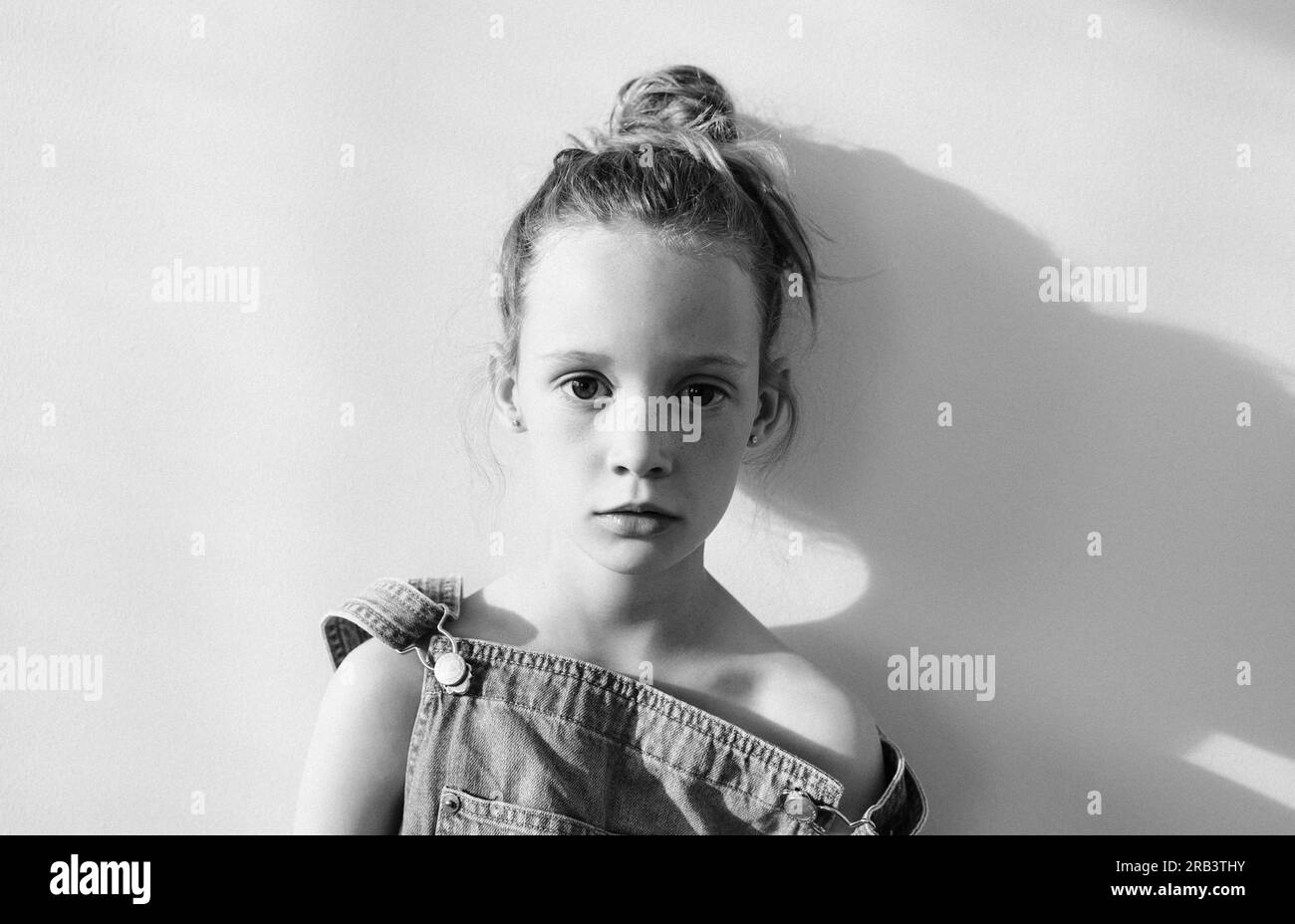 portrait of a young girl with freckles looking into the camera Stock ...