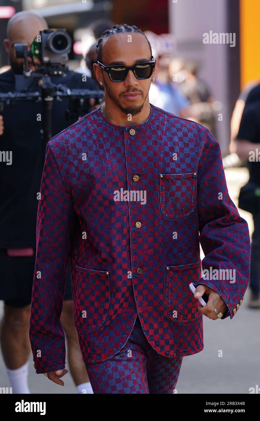 Lewis hamilton arrives in the paddock hi-res stock photography and ...