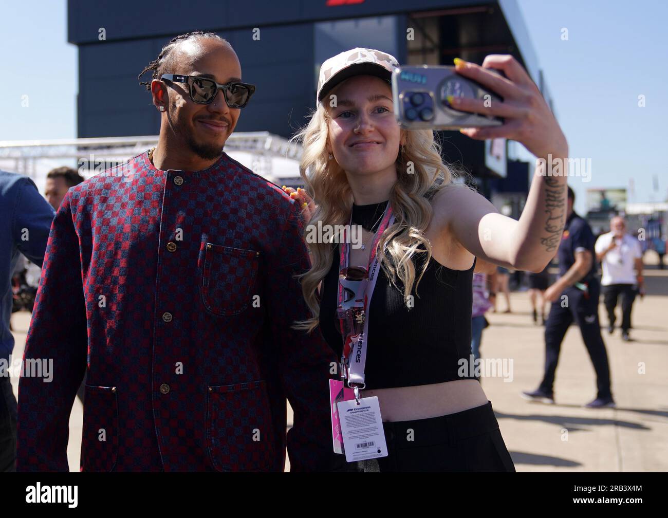 Lewis hamilton arrives in the paddock hi-res stock photography and ...