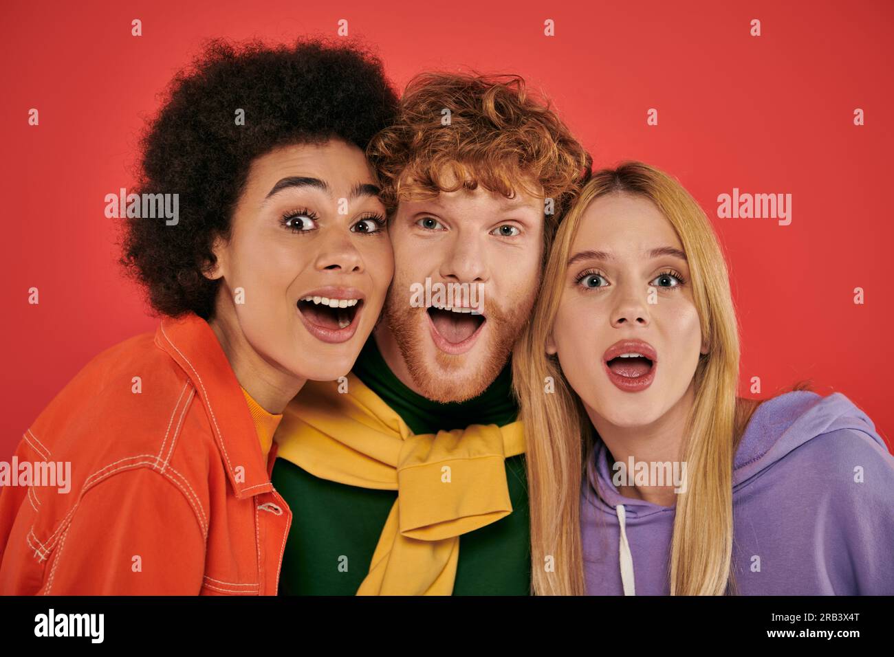 polyamorous concept, portrait of young man and multicultural women on ...