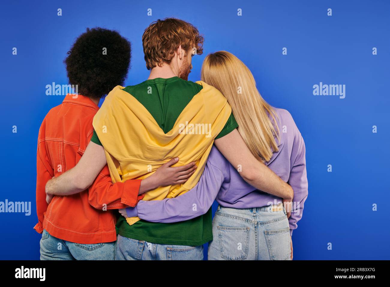 Back view three women hugging hi-res stock photography and images - Alamy