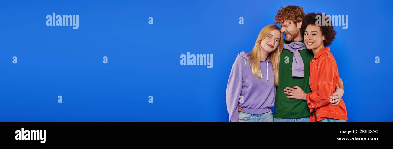 polyamory concept, cheerful multicultural women looking at camera and ...