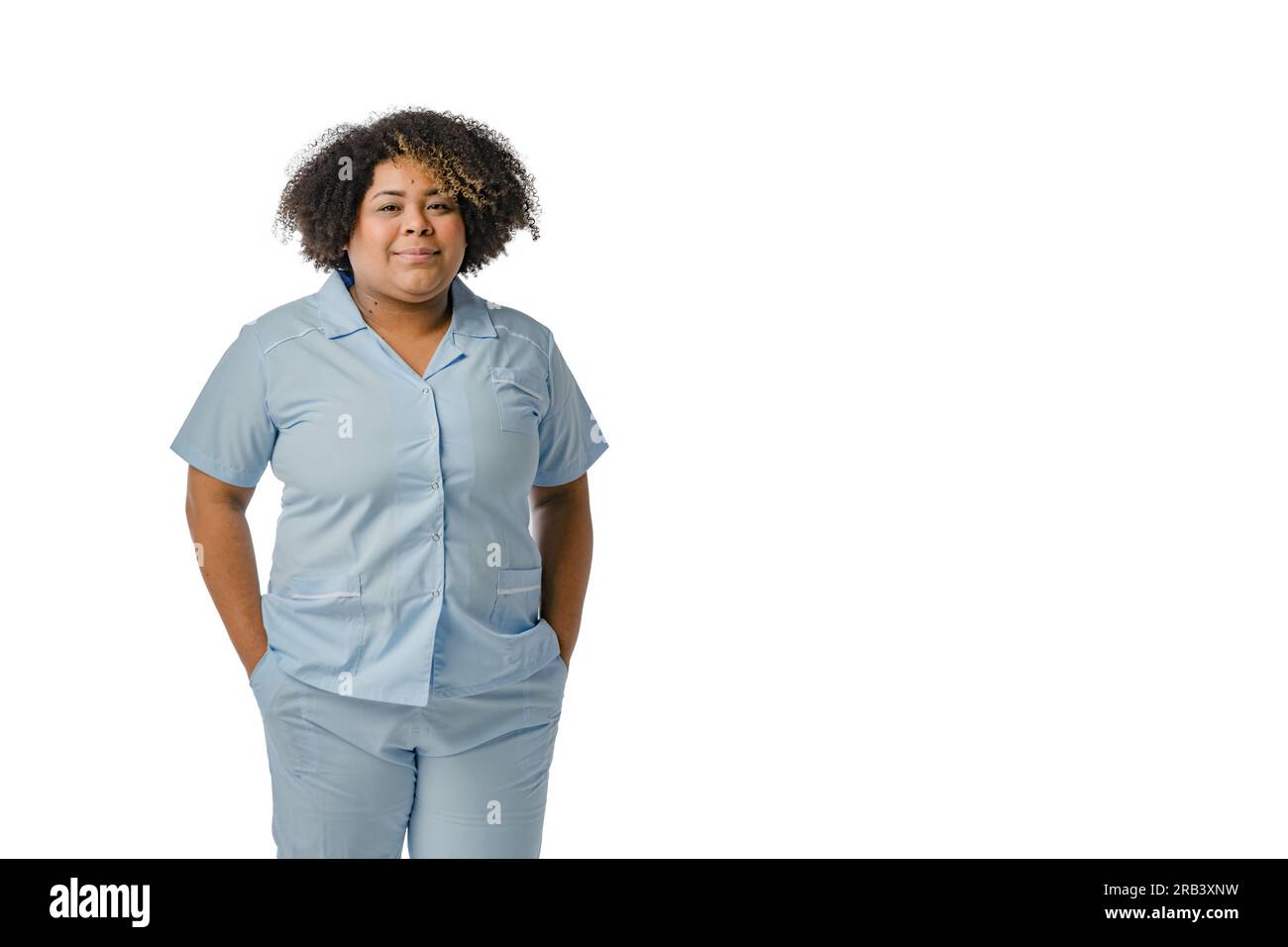 portrait of young Afro-Latin woman in blue color uniform, smiling with ...