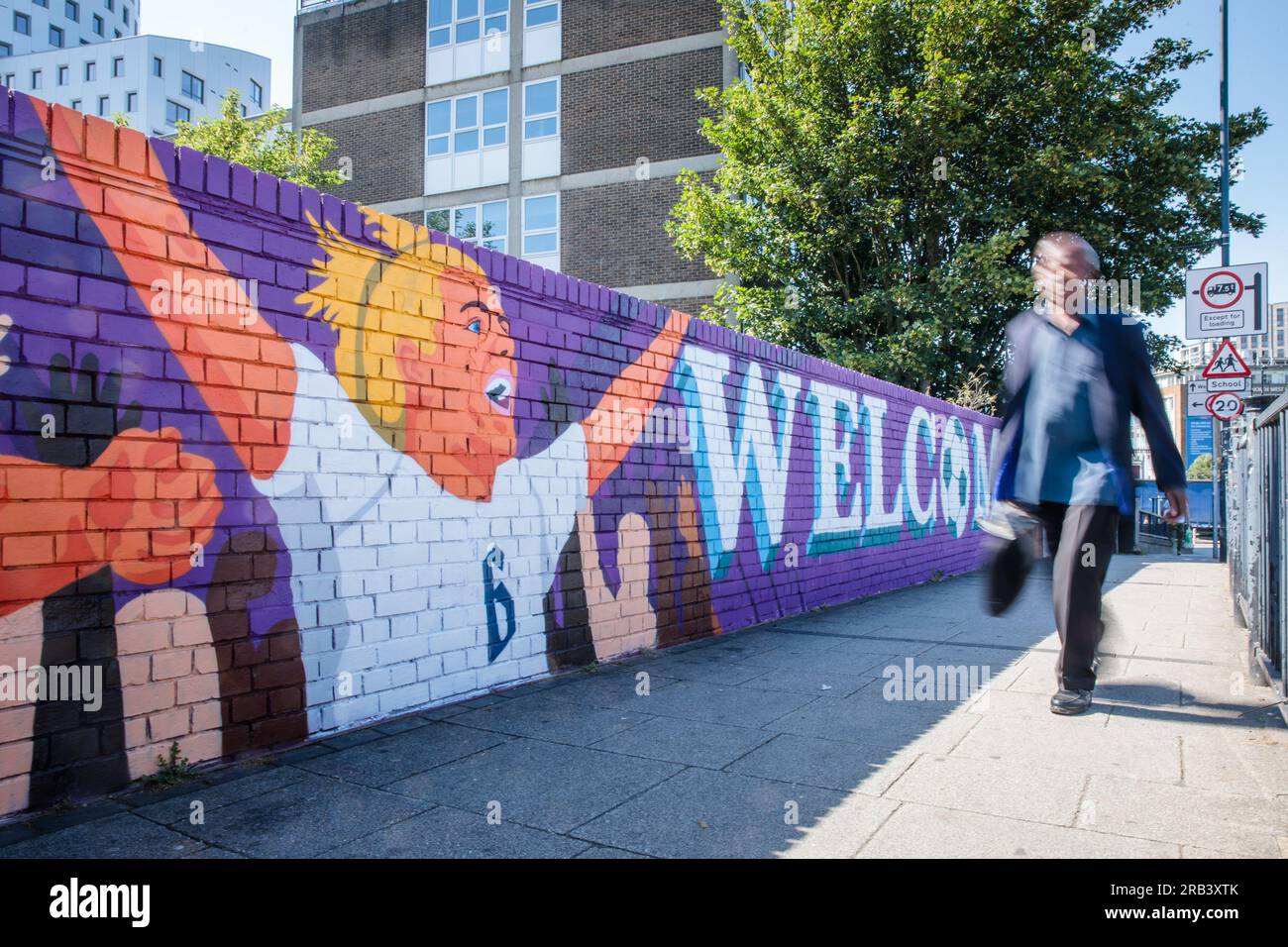 Bridge Road, Wembley, UK. July 2023. Artist, Nathan Evans, completes a ...
