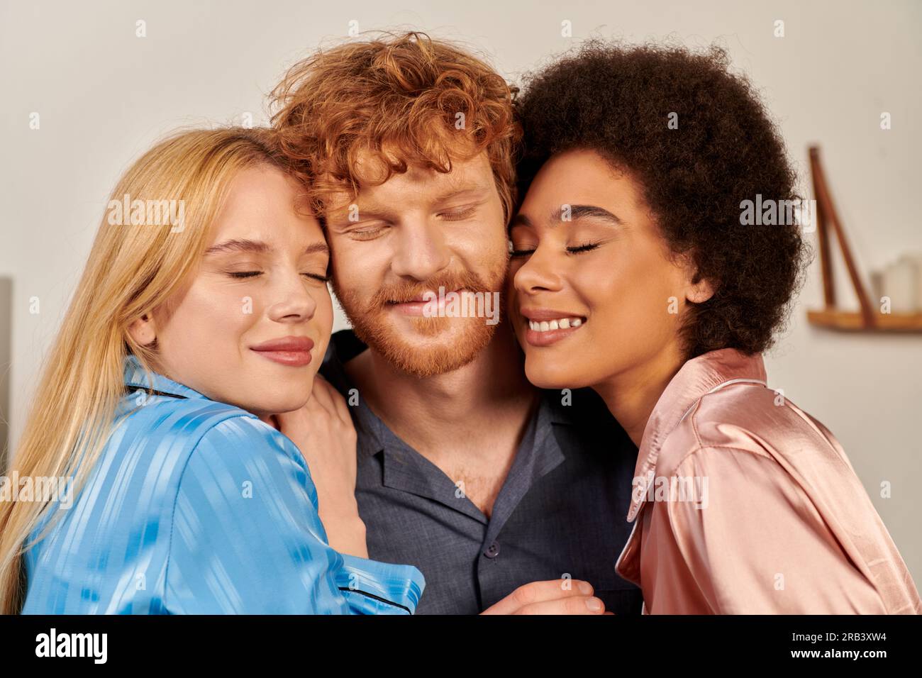 polygamy lovers, portrait of happy man with red hair and multicultural ...