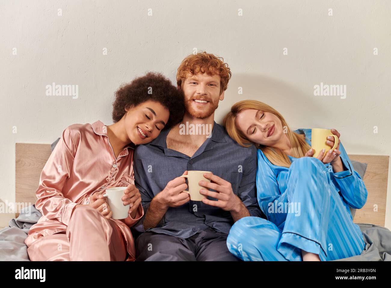 open relationship concept, polygamy, redhead man and multicultural ...