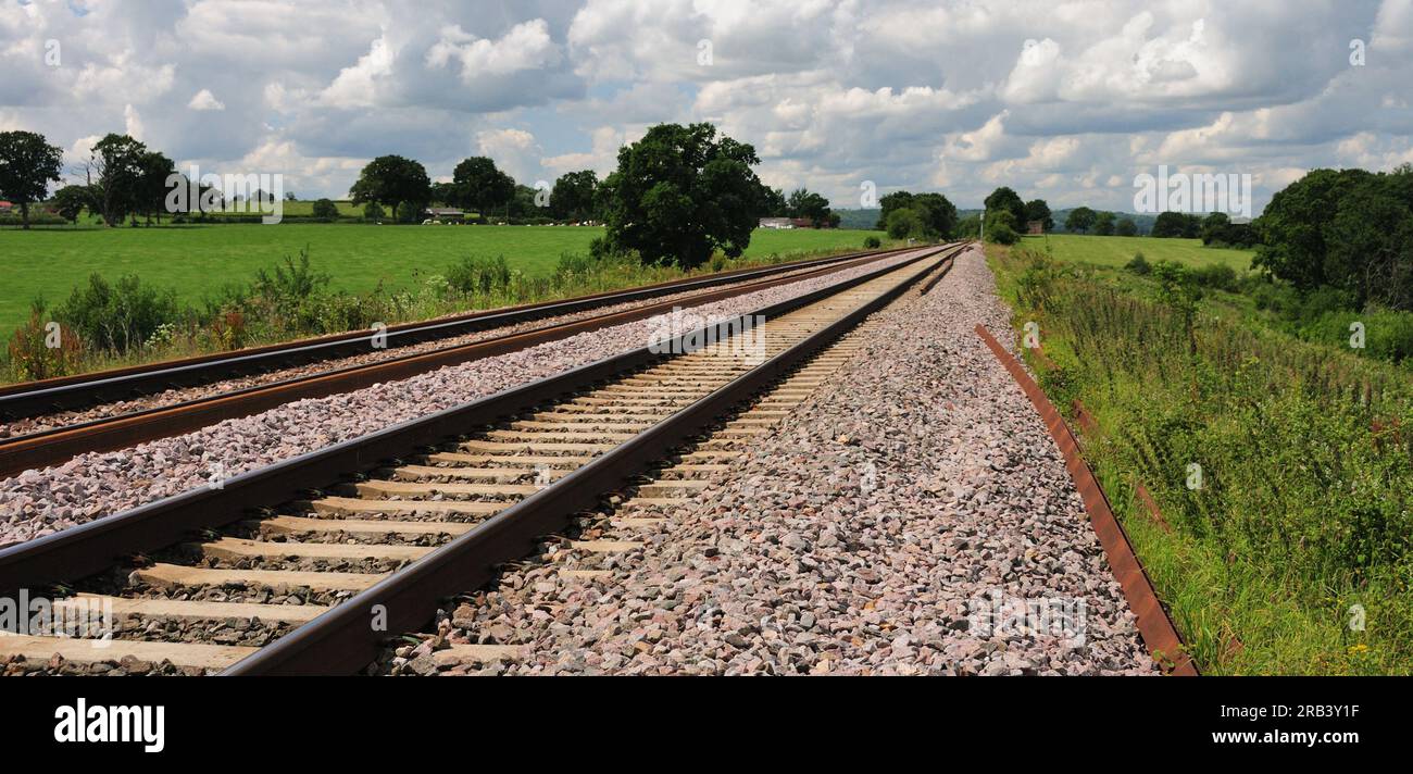 Lineside view of a double track railway line, as seen from a public ...