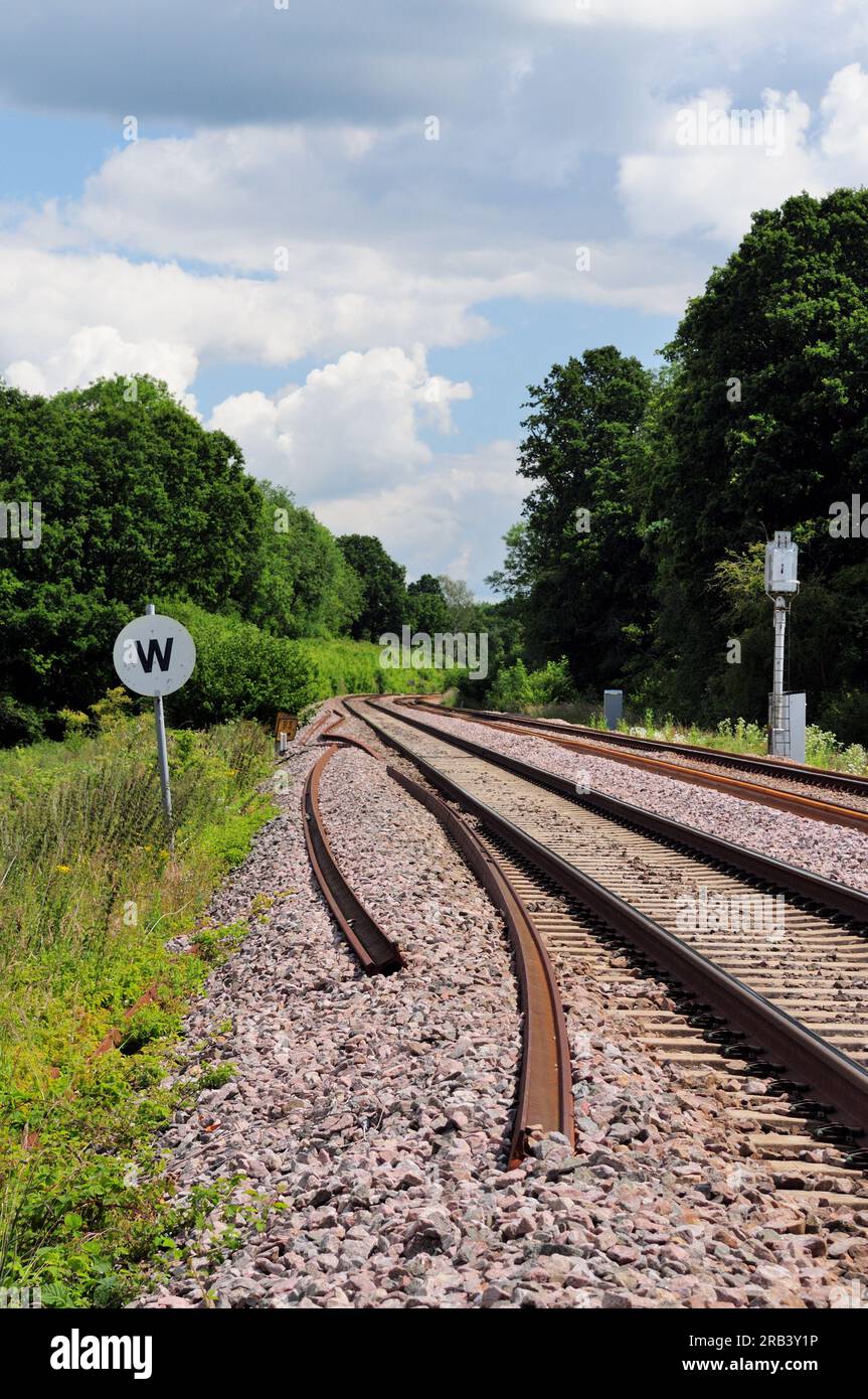 Lineside view of a double track railway line, as seen from a public ...