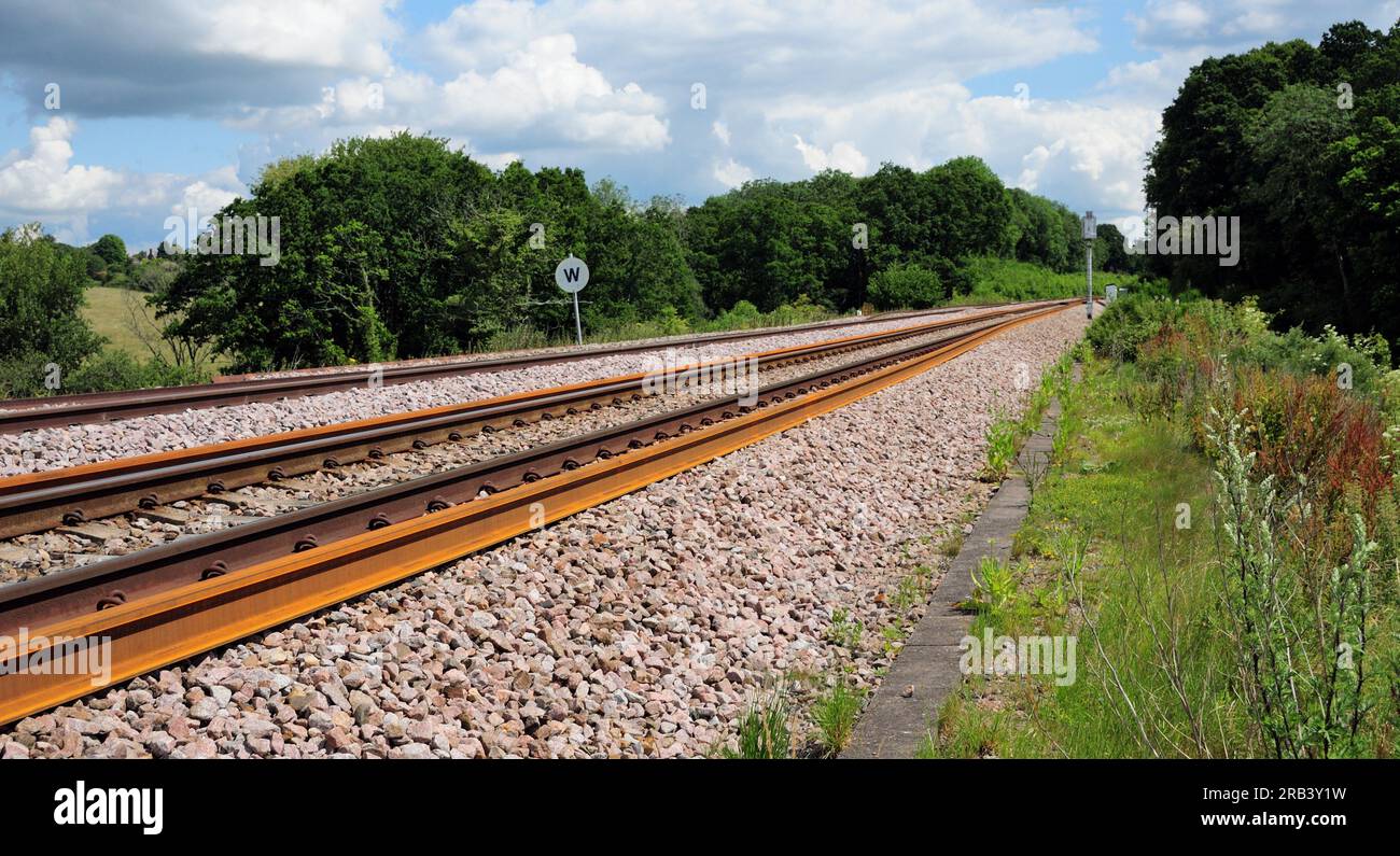 Lineside view of a double track railway line, as seen from a public ...