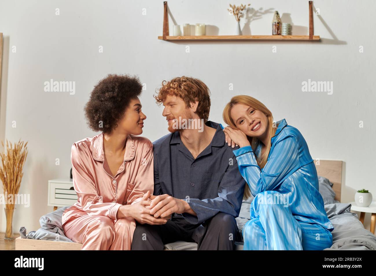 polygamy concept, understanding, three adults, redhead man and ...