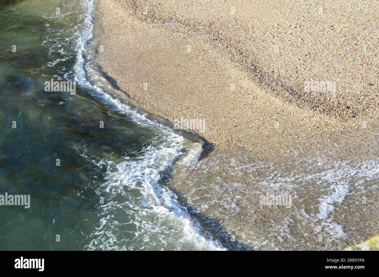 Surf lapping on sandy beach hi-res stock photography and images - Alamy