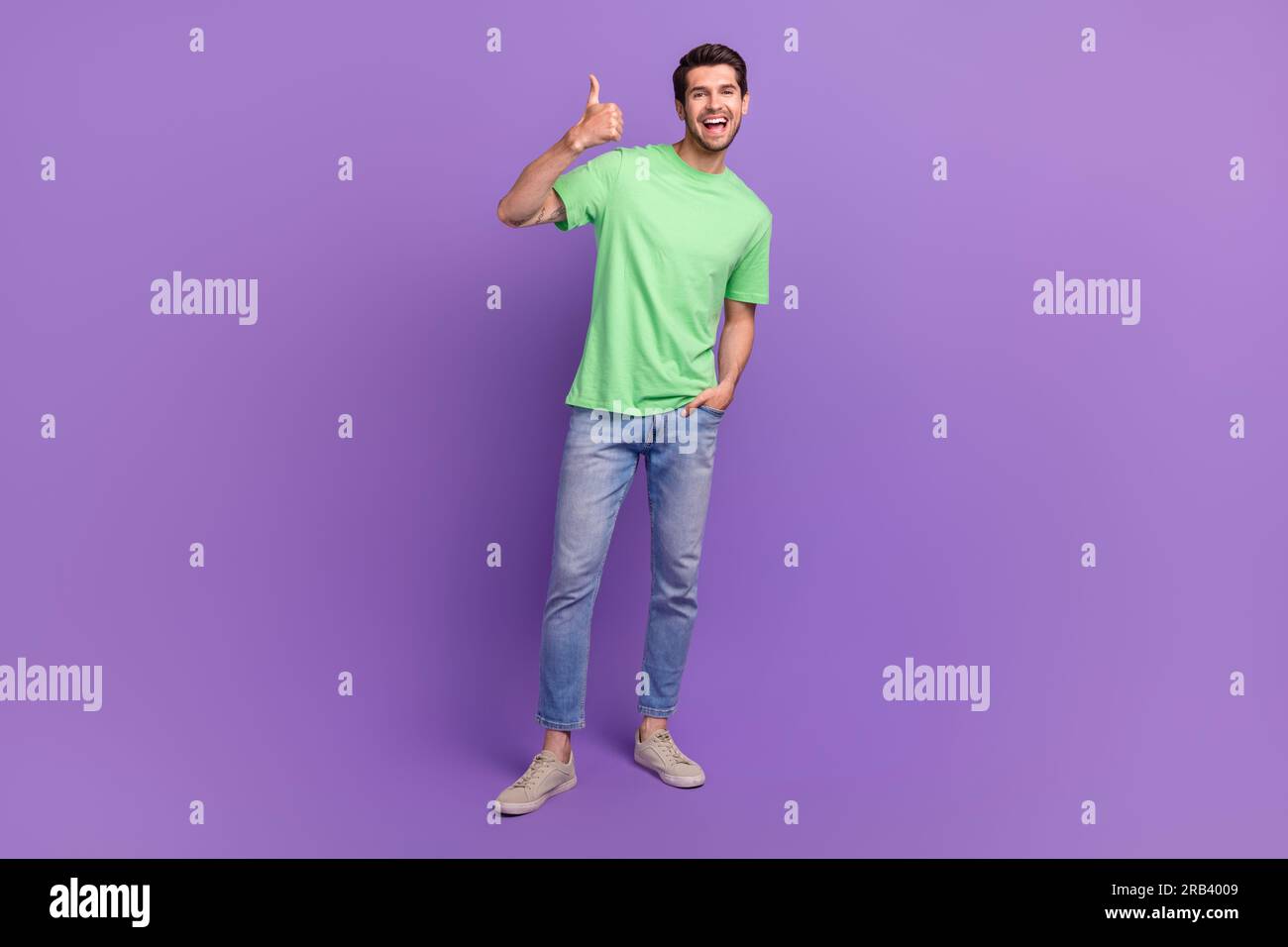 Full body cadre of young optimistic man showing thumb up recommendation ...