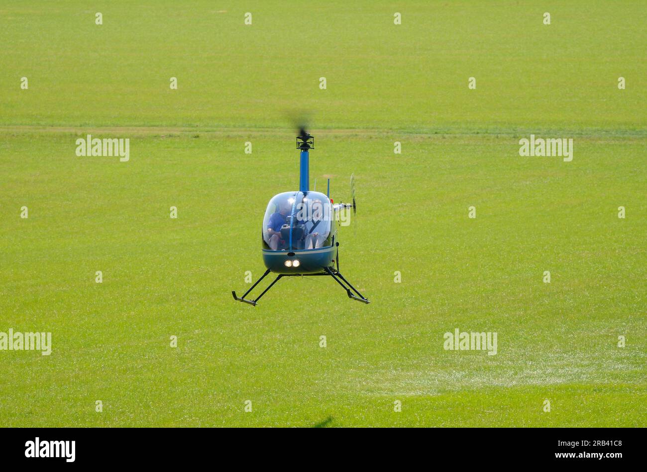 Robinson R-22 helicopter hovering low at a wings and wheels event in ...
