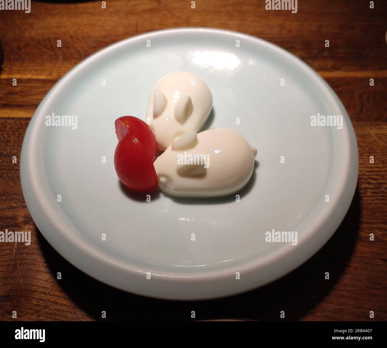 two rabbit shaped dessert in the white plate for eating Stock Photo - Alamy