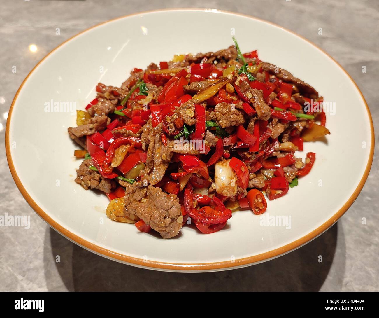 Fresh scrambled beef with red peppers in the plate for eating Stock ...