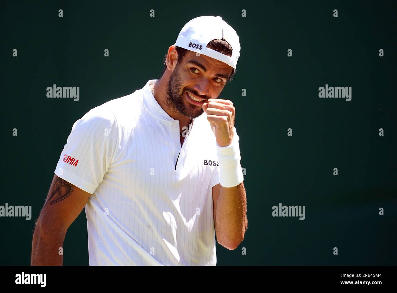 Matteo Berrettini reacts during his match against Alex De Minaur (not pictured) on day five of ...