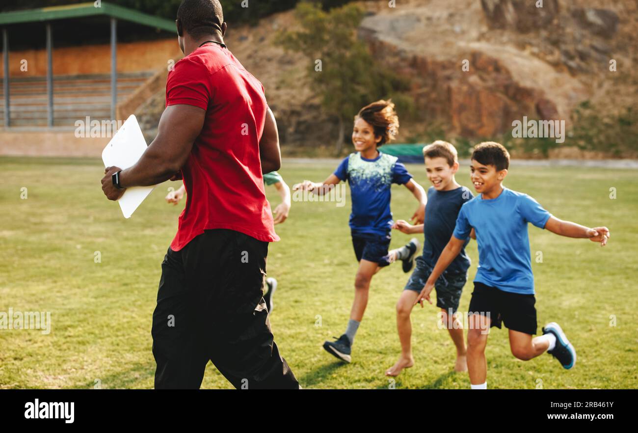Sports coach getting chased by his sports team. school sports team ...