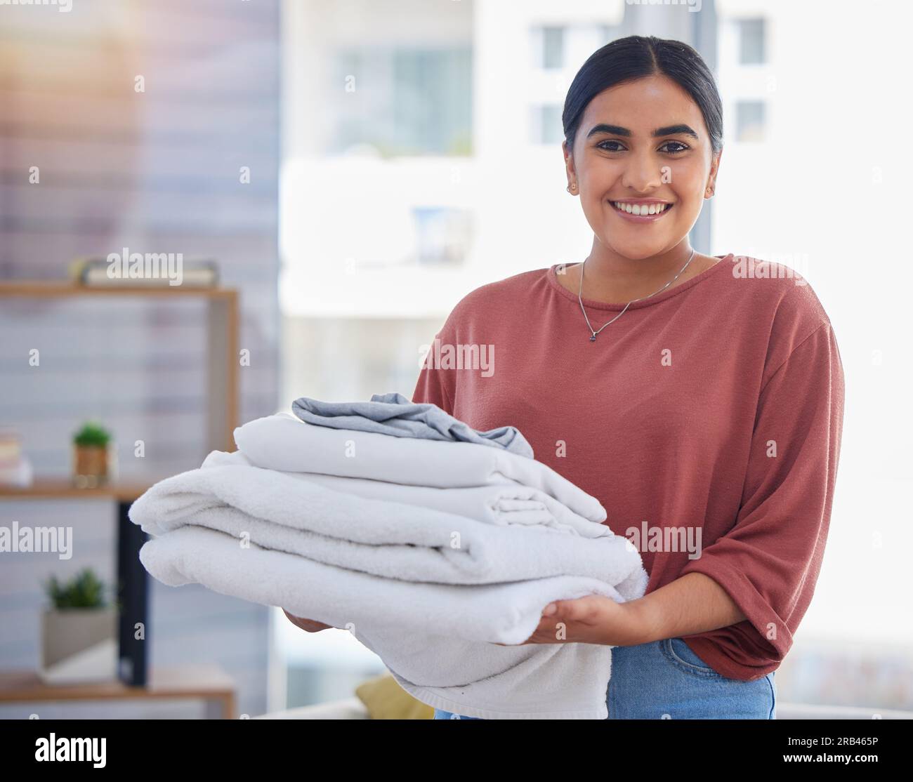 Cleaning, laundry and portrait of woman in living room for housekeeping ...