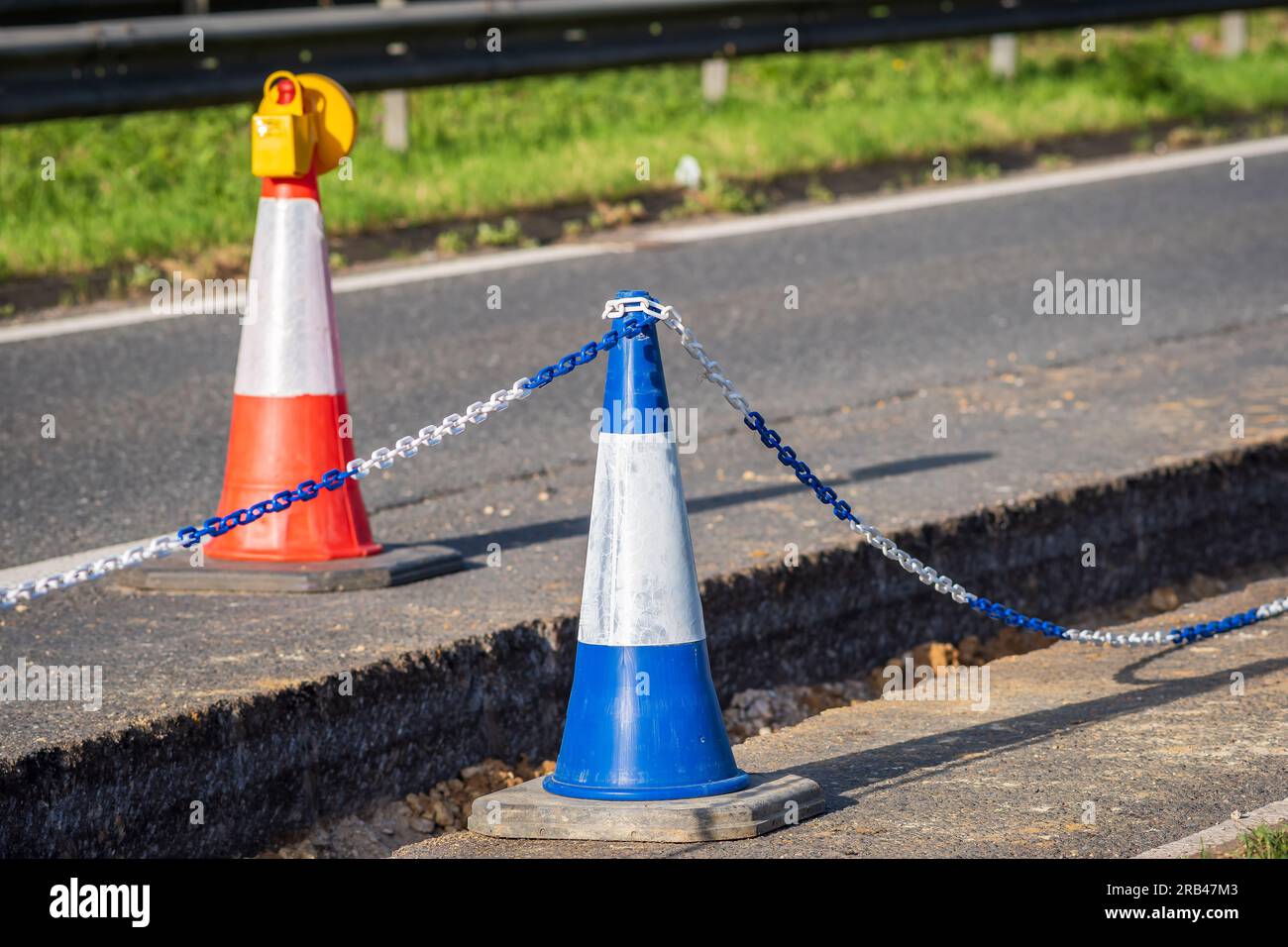 Roadworks cones on motorway in england uk Stock Photo - Alamy