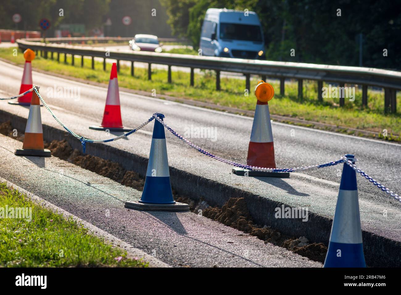 Roadworks cones on motorway in england uk Stock Photo - Alamy