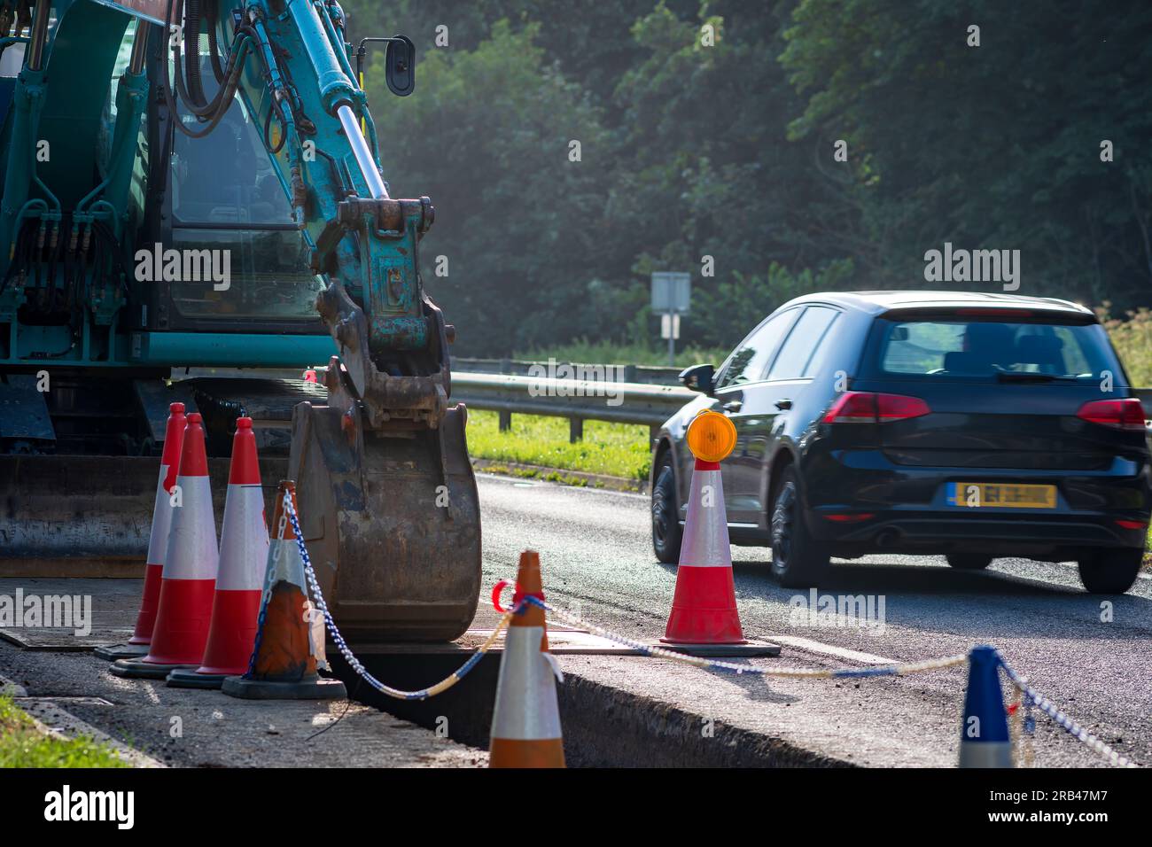 Roadworks cones on motorway in england uk Stock Photo - Alamy