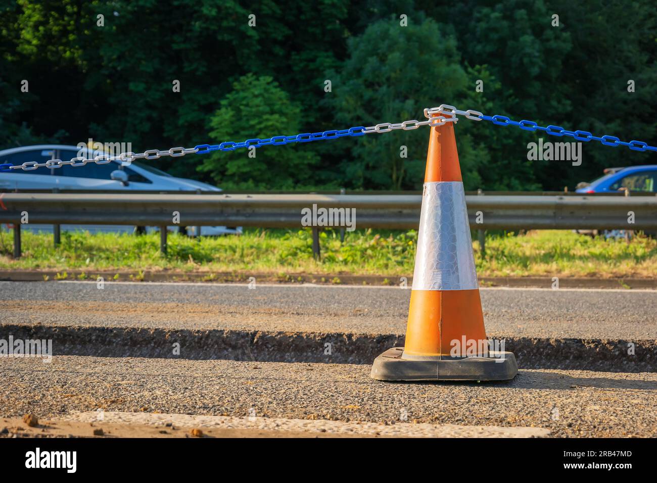 Roadworks cones on motorway in england uk Stock Photo - Alamy