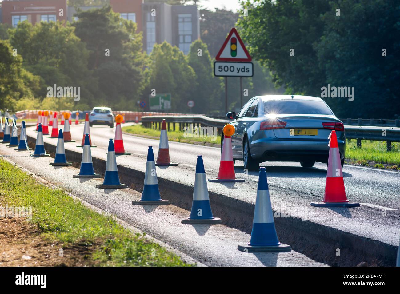 Roadworks cones on motorway in england uk Stock Photo - Alamy