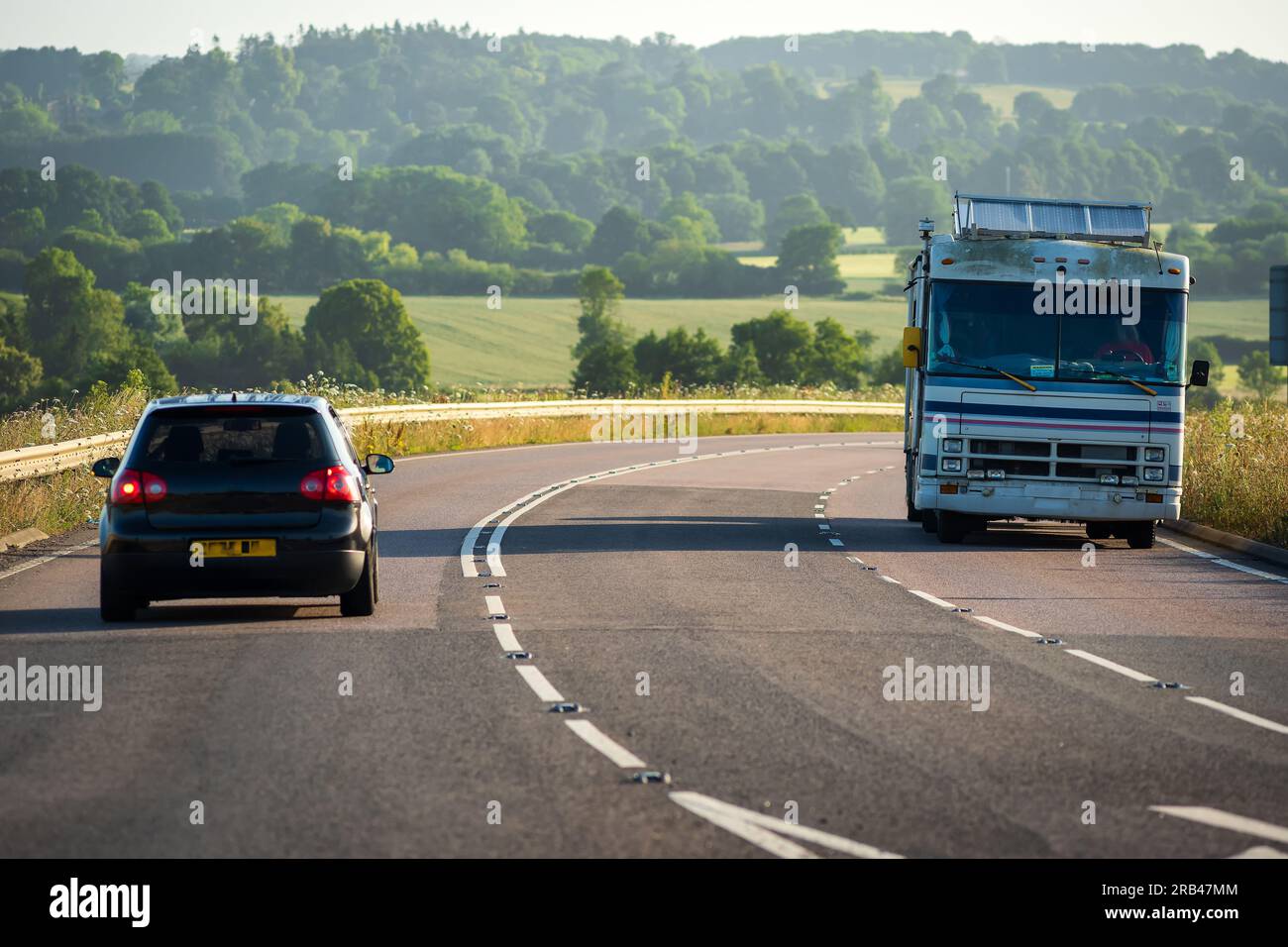 caravan moving at speed on uk motorway in england at sunrise Stock ...