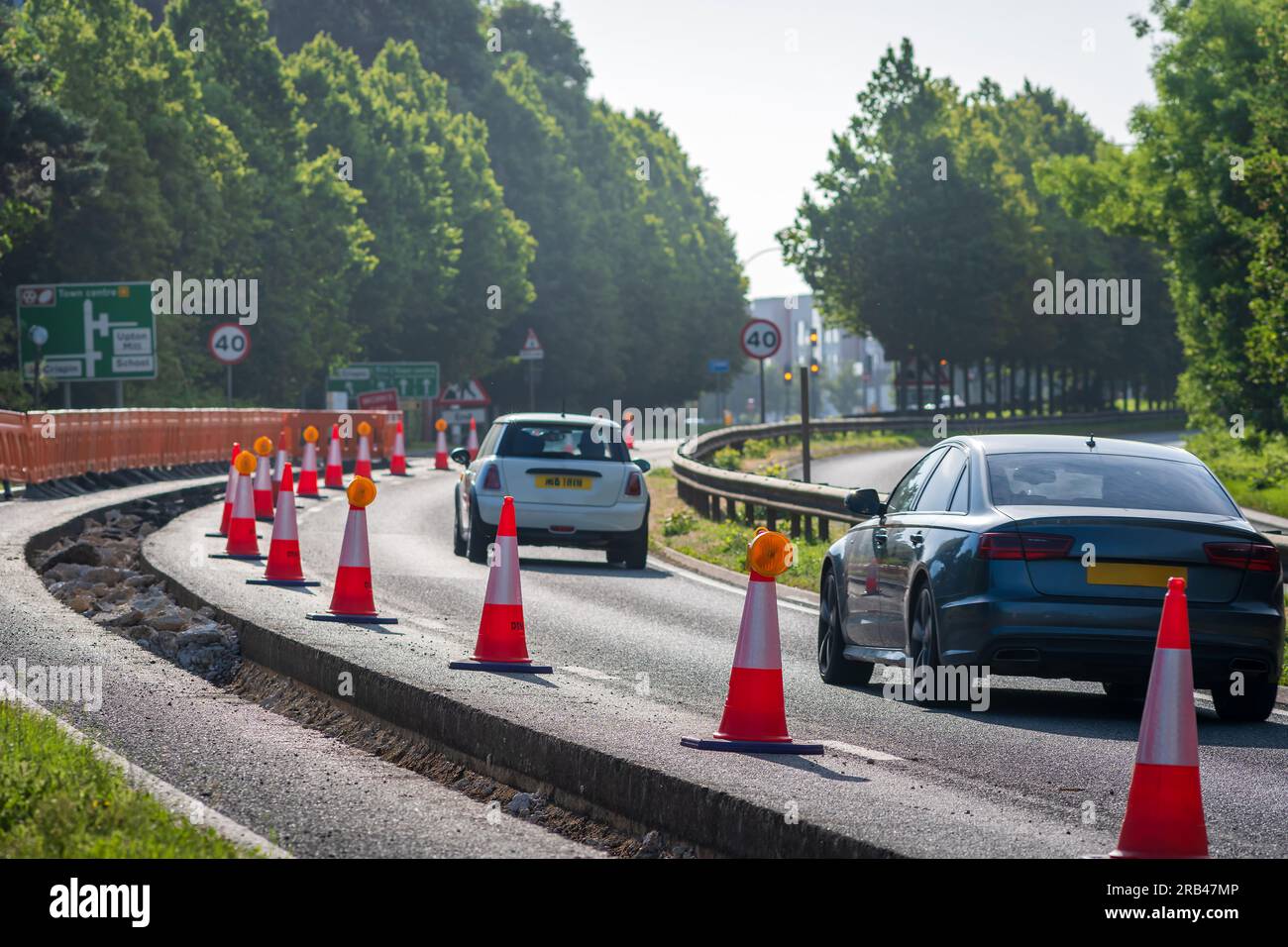 Roadworks cones on motorway in england uk Stock Photo - Alamy