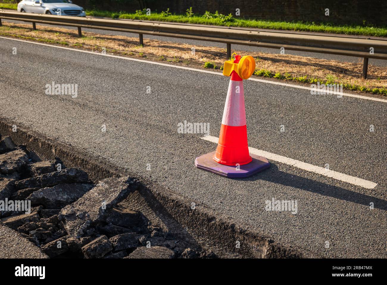 Roadworks cones on motorway in england uk Stock Photo - Alamy