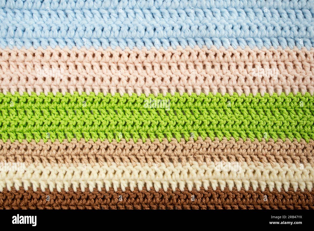 horizontal colored crochet lines pattern, beige, blue, green and brown ...